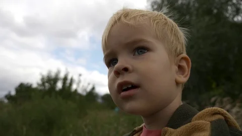 Serious Cute Child Points Finger Up In C... | Stock Video | Pond5