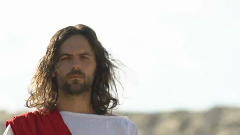 Serious Jesus in desert looking at camer... | Stock Video | Pond5