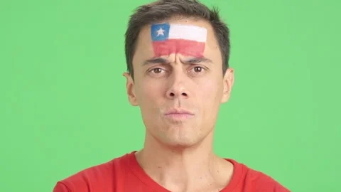 Serious man with a chilean flag painted ... | Stock Video | Pond5