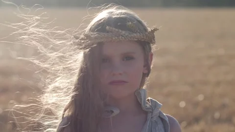 serious sad girl a child stands on a whe... | Stock Video | Pond5