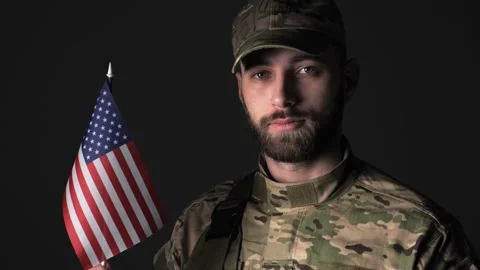 Serious soldier in a military uniform ho... | Stock Video | Pond5