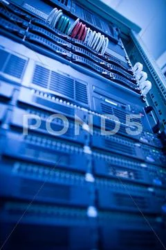 Photograph: Server rack cluster in a data center (shallow DOF; color ...