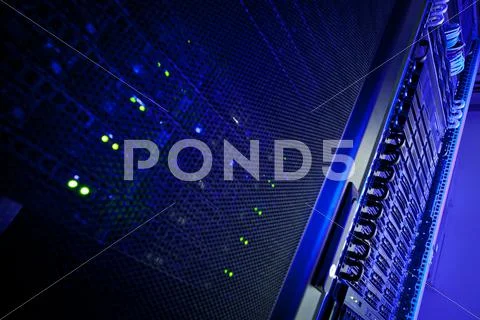 Server rack cluster in a data center (shallow DOF; color toned i Stock ...