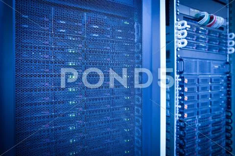 Photograph: Server rack cluster in a data center (shallow DOF; color ...