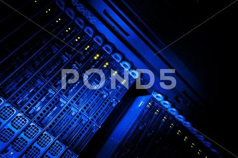 Photograph: Server rack cluster in a data center (shallow DOF; color ...