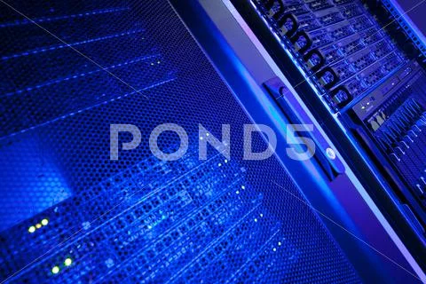 Photograph: Server rack cluster in a data center (shallow DOF; color ...