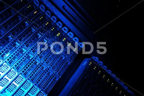 Server rack cluster in a data center (shallow DOF; color toned i ...
