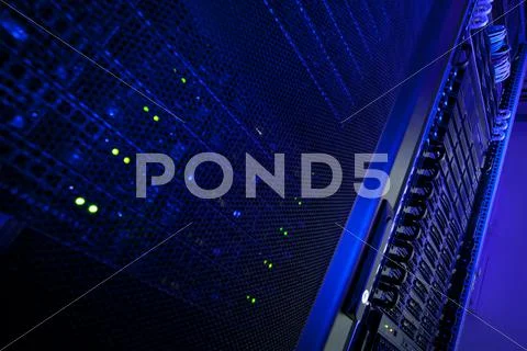 Server rack cluster in a data center (shallow DOF; color toned i Stock ...