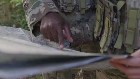 Service Members with a Map Making a Plan | Stock Video | Pond5