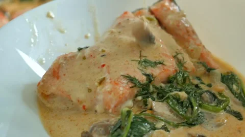 serving a cooked salmon fish | Stock Video | Pond5