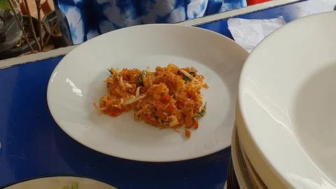 Serving/Putting Freshly cooked food/pad ... | Stock Video | Pond5