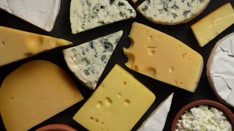 Set of different cheeses on black backgr... | Stock Video | Pond5