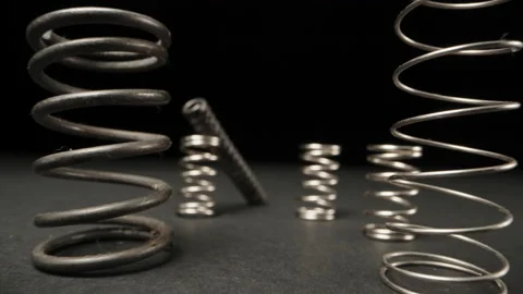 A set of metal springs are on the table,... | Stock Video | Pond5