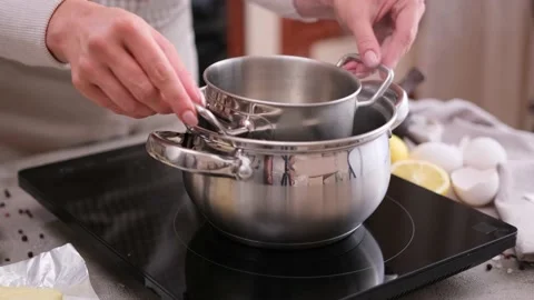 Setting up bain-marie Pot of boiling wat... | Stock Video | Pond5