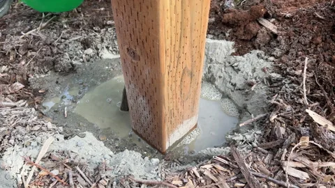 Setting a Level Fence Post Pouring Water... | Stock Video | Pond5