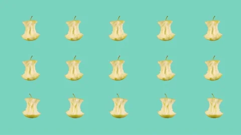 Several apple cores rotate on a blue bac... | Stock Video | Pond5