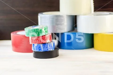 Several rolls of duct tape stacked in a pyramid. stack of electrical ...