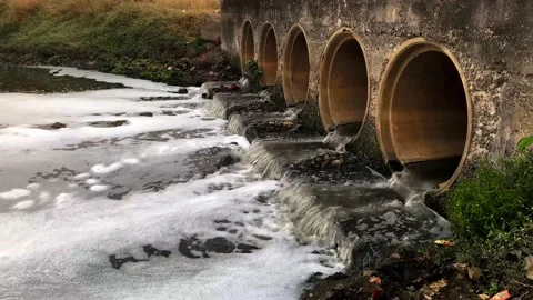 Sewage water flowing into river body and... | Stock Video | Pond5