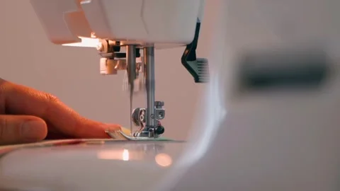 Sewing with a sewing machine close-up in... | Stock Video | Pond5