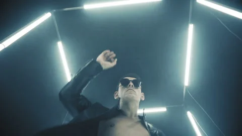Sexy man dancing in light cube | Stock Video | Pond5