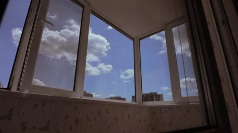 Sexy woman looks at the window on balcon... | Stock Video | Pond5