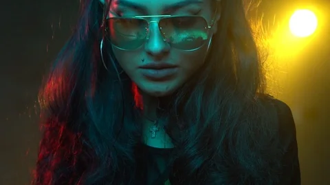 Sexy woman smoking in neon color light | Stock Video | Pond5