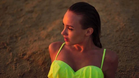 Sexy young lady in swimsuit at sunset at... | Stock Video | Pond5