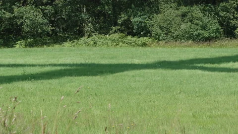A shadow cast of a rotating 3 blade wind... | Stock Video | Pond5