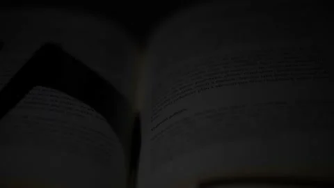 Shadow of death figure creeping on pages... | Stock Video | Pond5