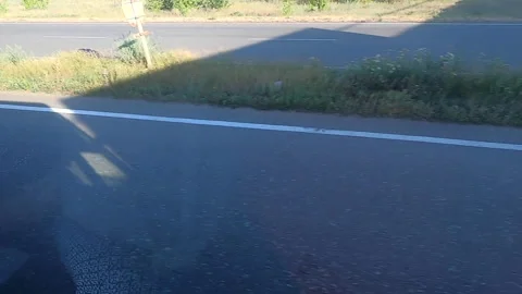 Shadow of driver's cabin of bus driving ... | Stock Video | Pond5