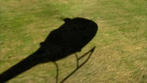 shadow of flying helicopter falling on t... | Stock Video | Pond5
