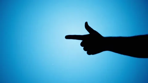 Shadow of hand showing gun with fingers ... | Stock Video | Pond5