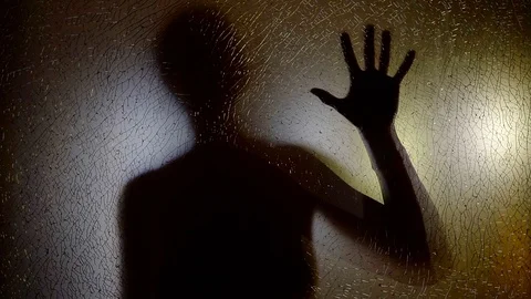 shadow of human figure on a glass screen... | Stock Video | Pond5
