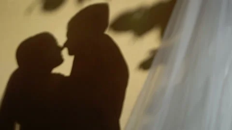 Shadow on yellow wall of couple in love ... | Stock Video | Pond5
