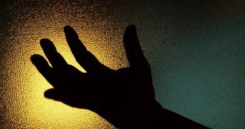 Shadow of a zombie hand, behind frosted ... | Stock Video | Pond5