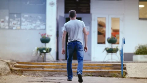 In the Shadows: The Menacing Figure Appr... | Stock Video | Pond5