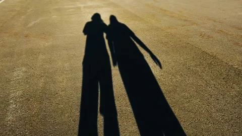 Shadows of two people a man and a woman ... | Stock Video | Pond5