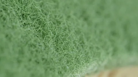 Shallow DOF rough side of kitchen sponge... | Stock Video | Pond5