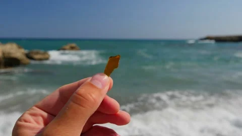 A shard of glass in a male hand against ... | Stock Video | Pond5