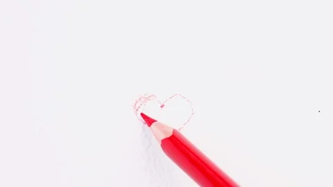 A sharp red pencil drawing a heart on wh... | Stock Video | Pond5