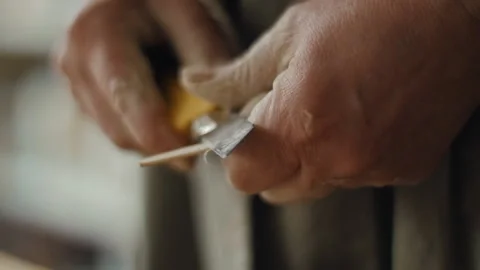 sharpen a wooden stick with stationery k... | Stock Video | Pond5