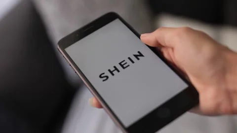 Shein logo on the screen of mobile phone... | Stock Video | Pond5