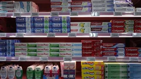 Shelves with toothpaste in the supermark... | Stock Video | Pond5