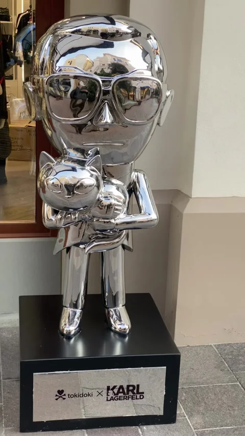 Shiny chrome statue of designer Karl Lag... | Stock Video | Pond5
