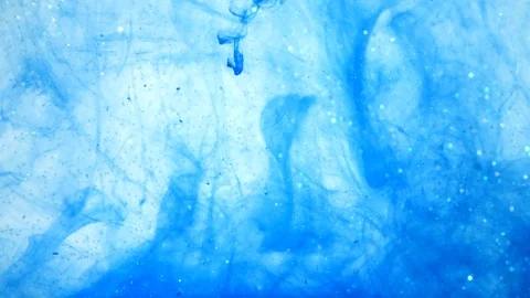 A shiny metallic blue ink drop in water ... | Stock Video | Pond5