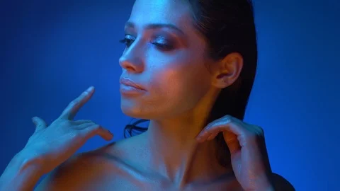 Shiny model with glitter makeup standing... | Stock Video | Pond5