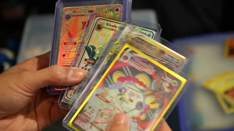 Shiny Pokemon Cards - Looking through Tr... | Stock Video | Pond5