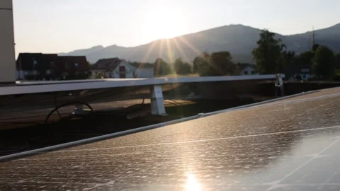 Shiny rain drops on solar cell near a wh... | Stock Video | Pond5
