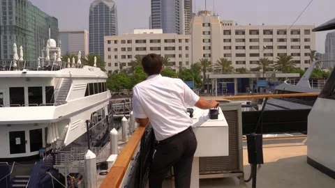 Ship captain master in uniform docking t... | Stock Video | Pond5