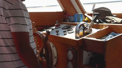 A ship captain stands at the helm and co... | Stock Video | Pond5